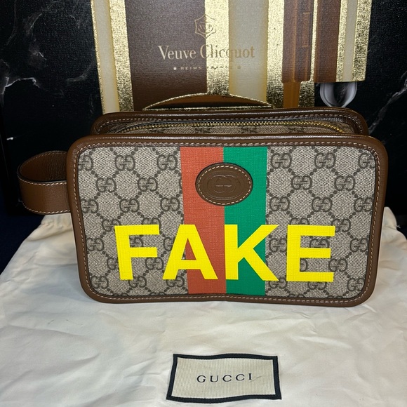 Gucci | Bags | Gucci Gg Fake Not Clutch Bag | Poshmark